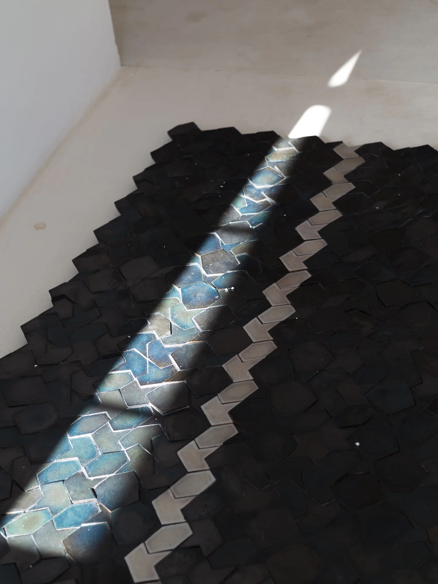 The moment light hits the oxide. This piece, made with ceramic tiles ...